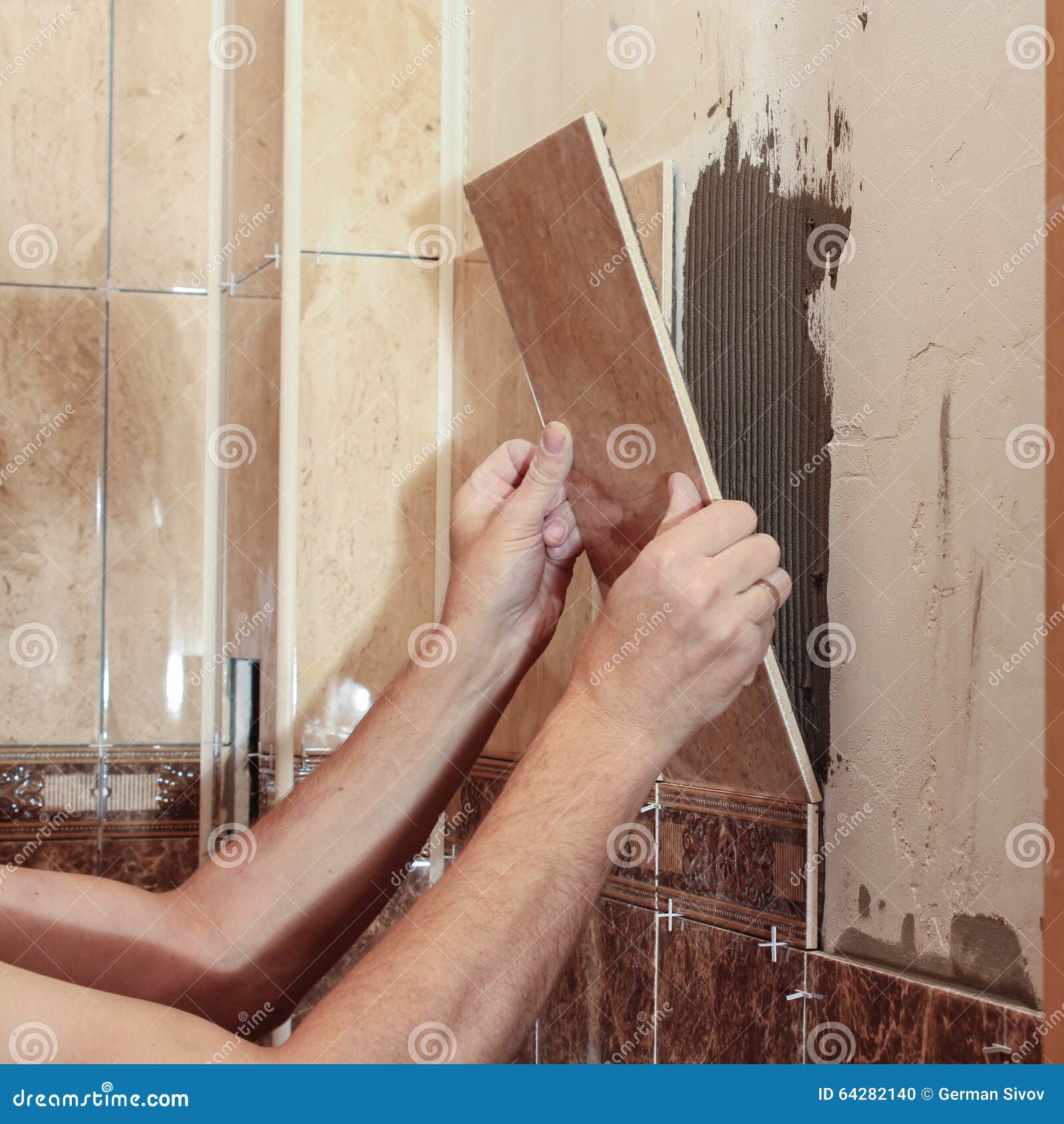 Bonding of Tiles on the Wall. Stock Photo - Image of construction ...