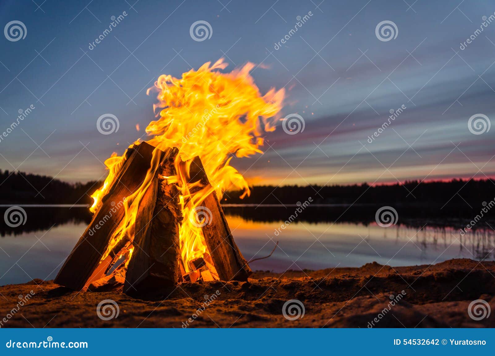 Bonfire on the beach sand stock photo. Image of flame - 54532642