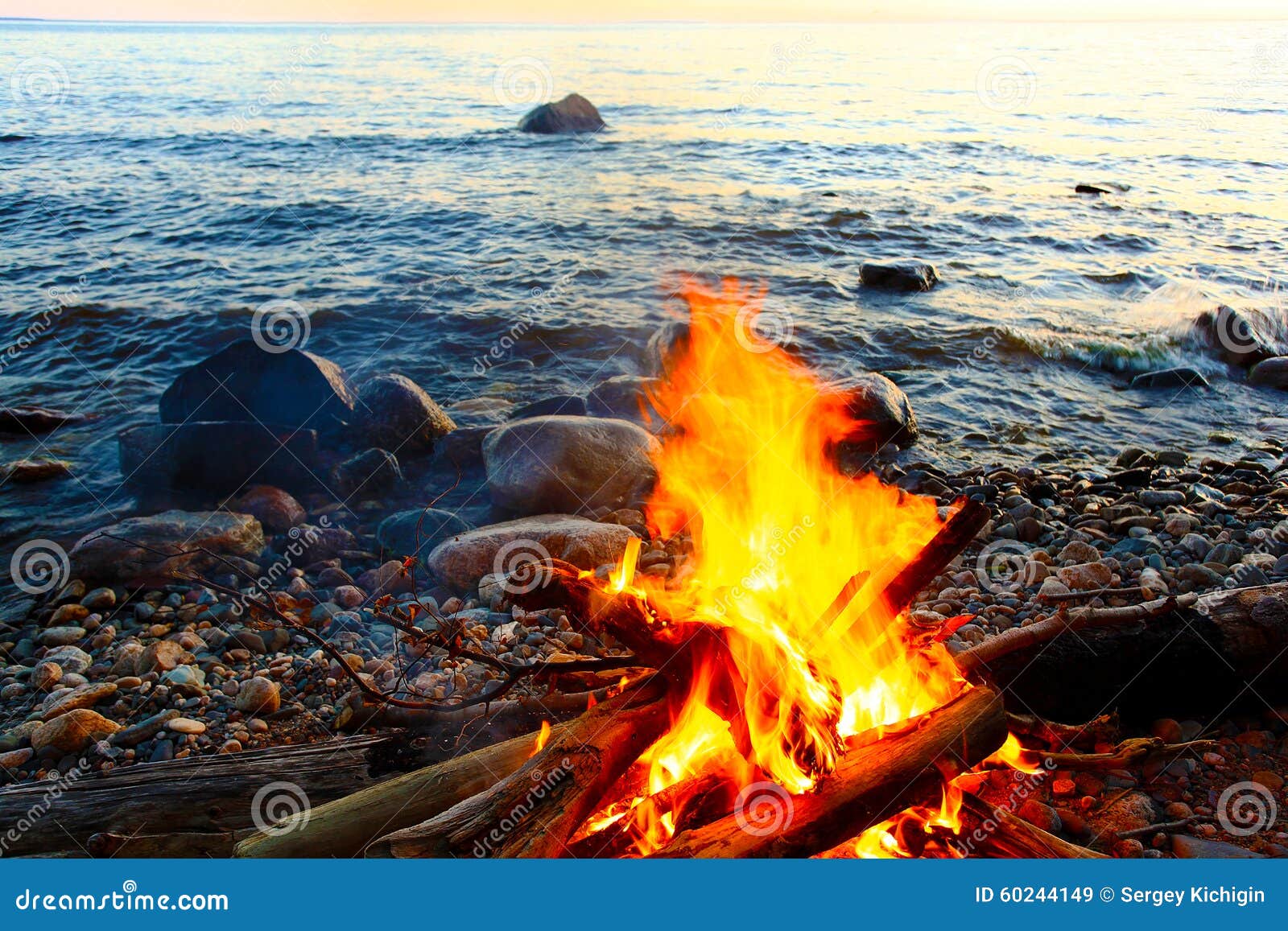 Bonfire at evening lake stock image. Image of horizon - 60244149
