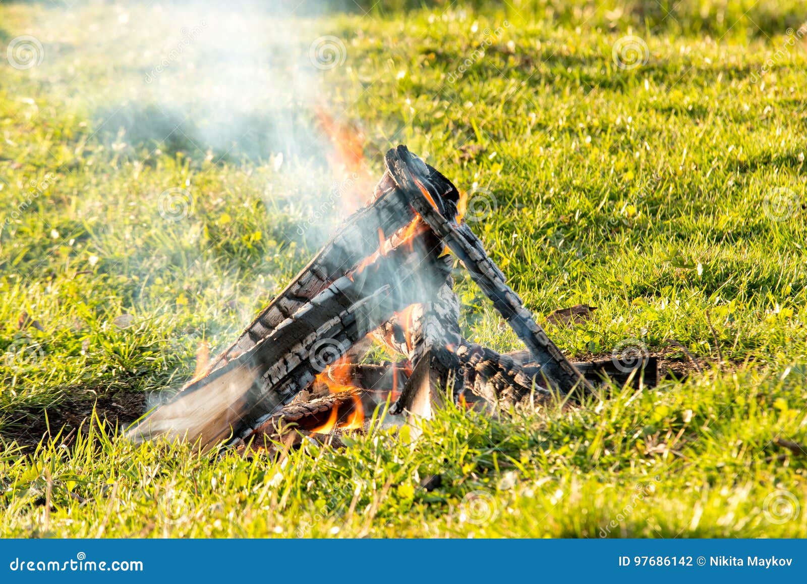 Bonfire on the Field in the Light of the Setting Sun Stock Photo ...
