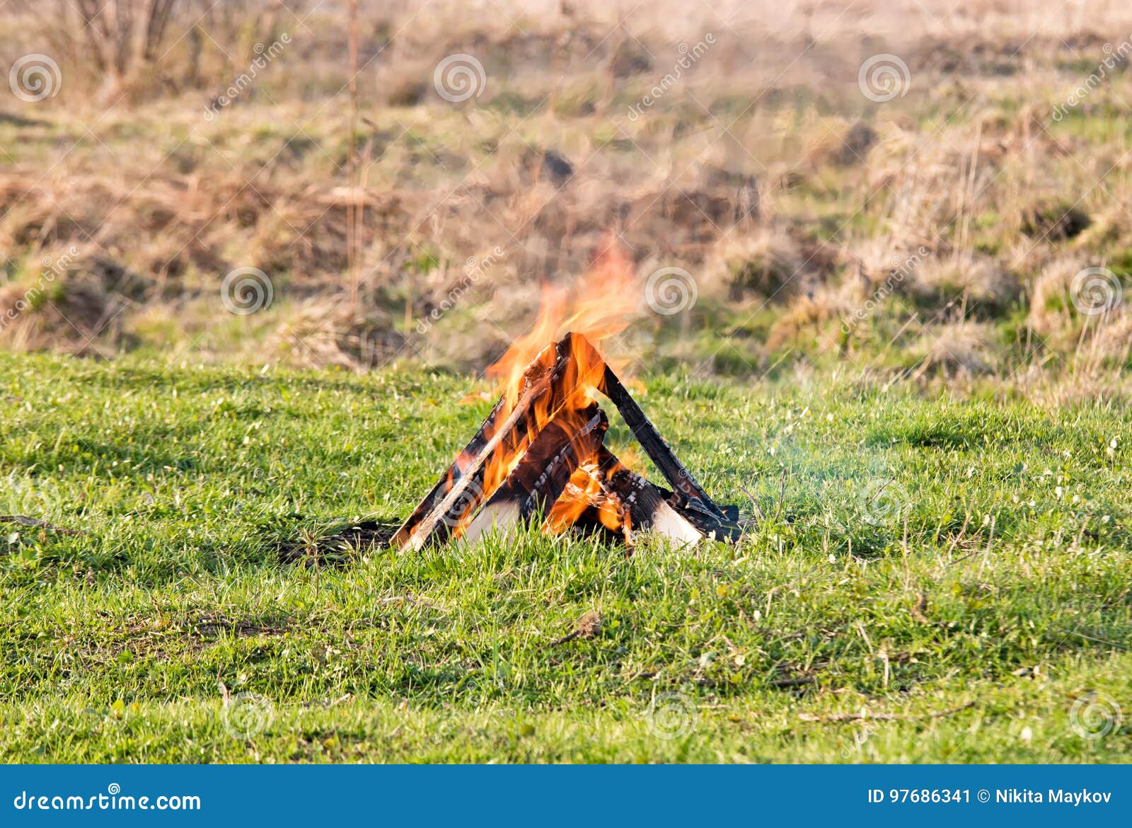 Bonfire on the Field in the Light of the Setting Sun Stock Image ...