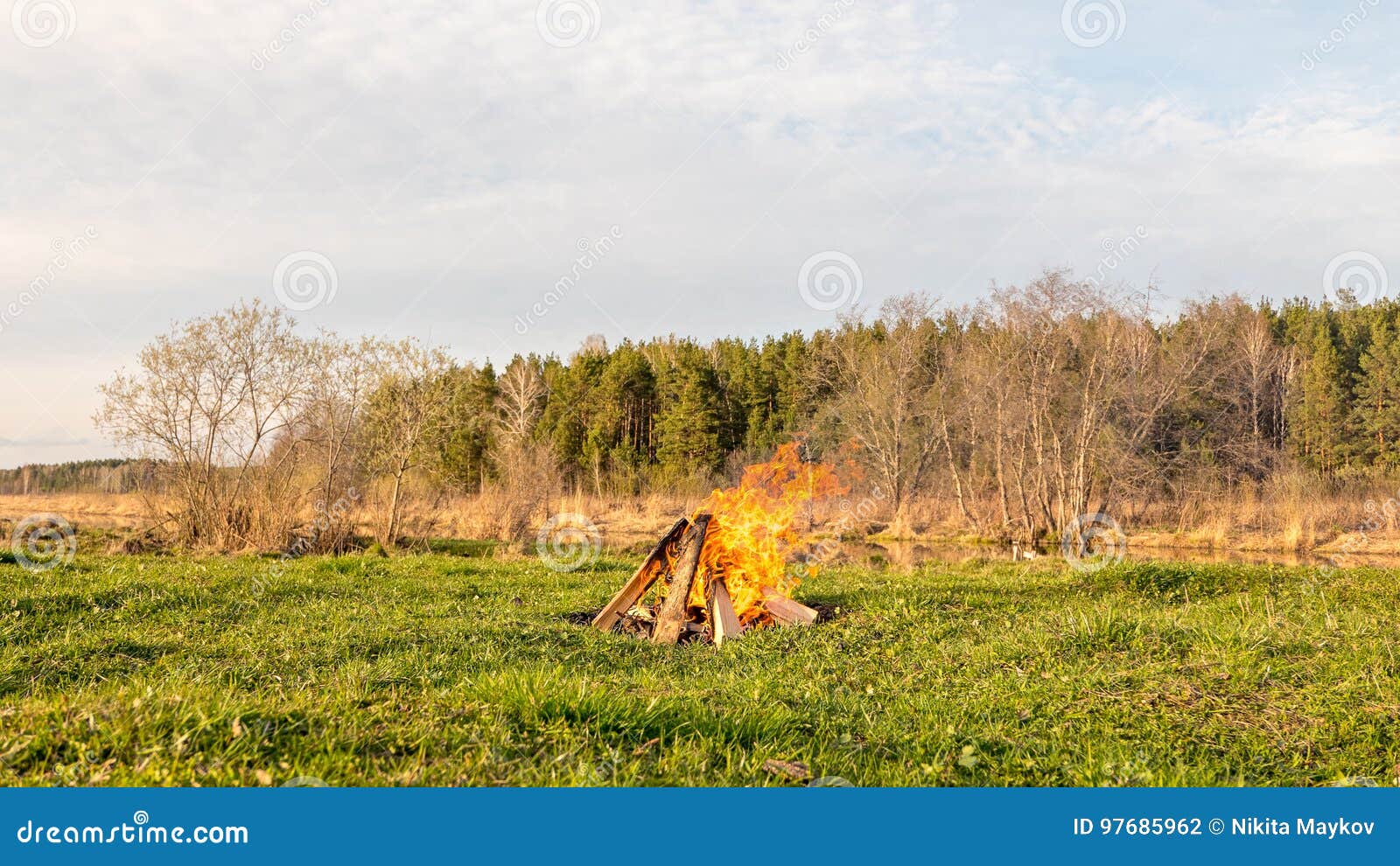 A Bonfire in the Field Near the River Stock Photo - Image of camp ...