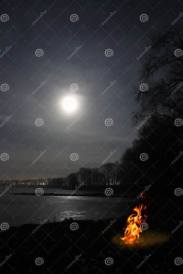 Bonfire Flame and Moon Over Lake Stock Image - Image of bonfire ...