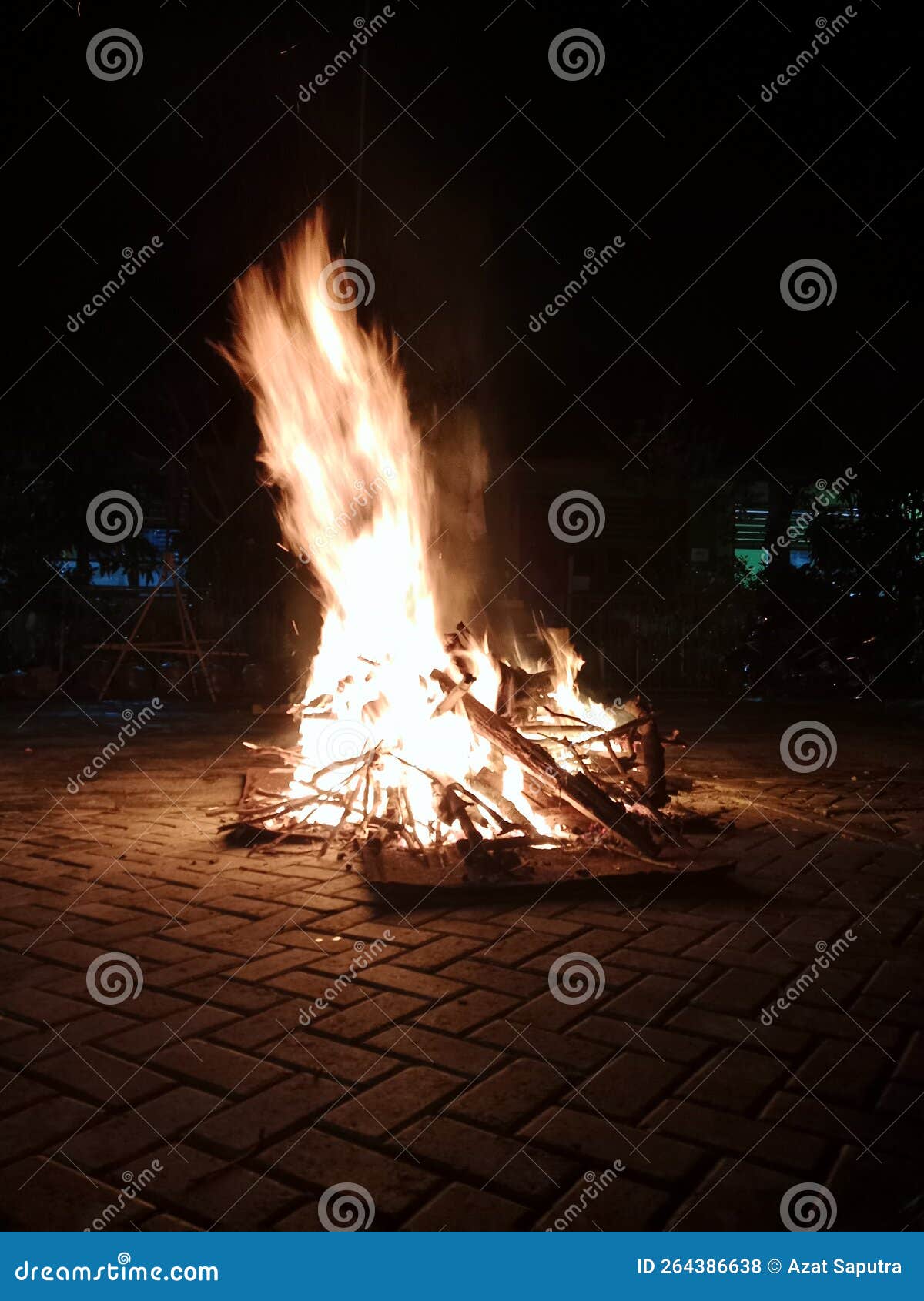 Bonfire lighting at night stock photo. Image of night - 264386638