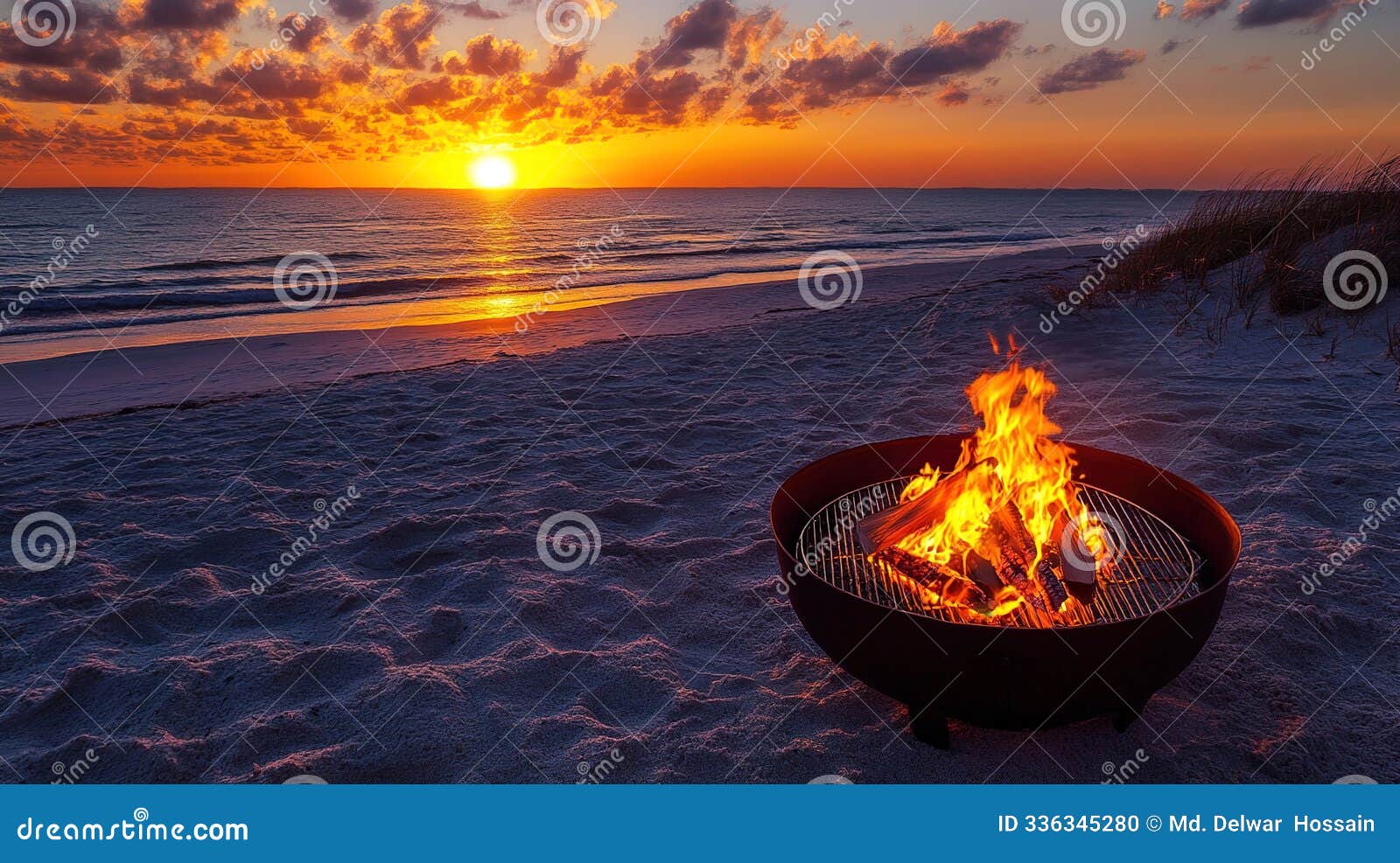 Bonfire Lit on the Beach at Sunset with Ocean Waves in Background Stock ...