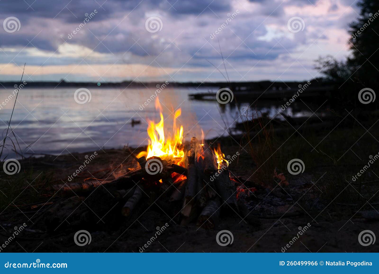 Bonfire on the Shore of the Lake at Sunset Stock Photo - Image of beach ...