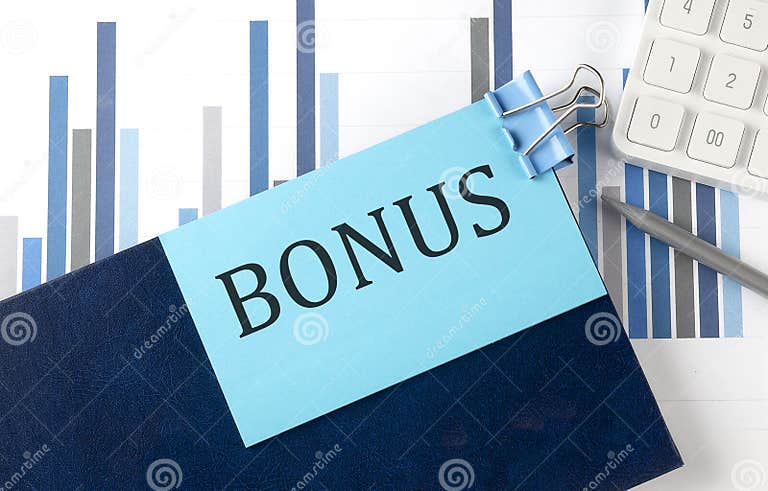 BONUS on Sticky Note on Notebook on the Chart Background Stock Image ...