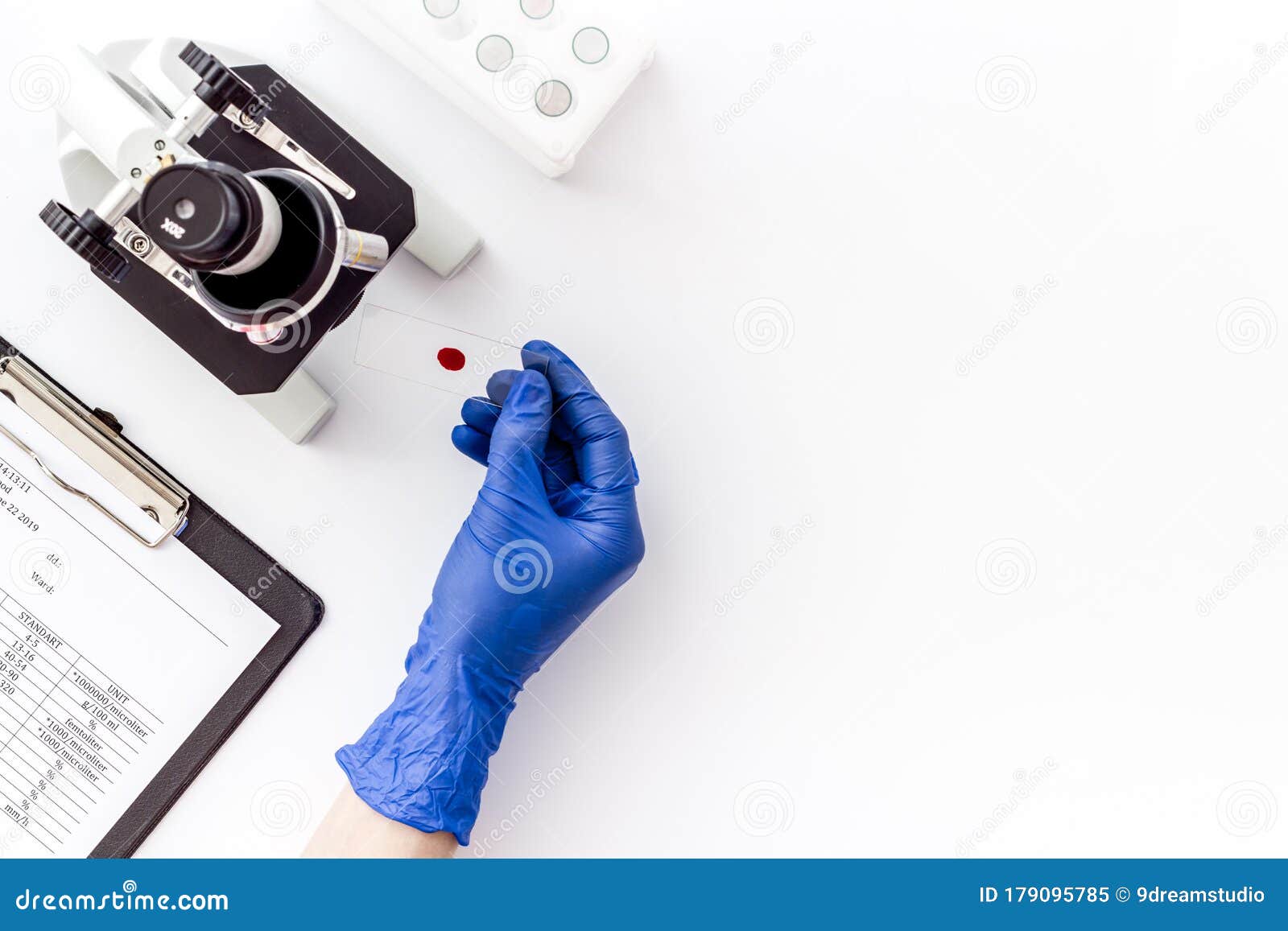 Bood Testing with Microscope in Laboratory. Sample in Hands on White ...