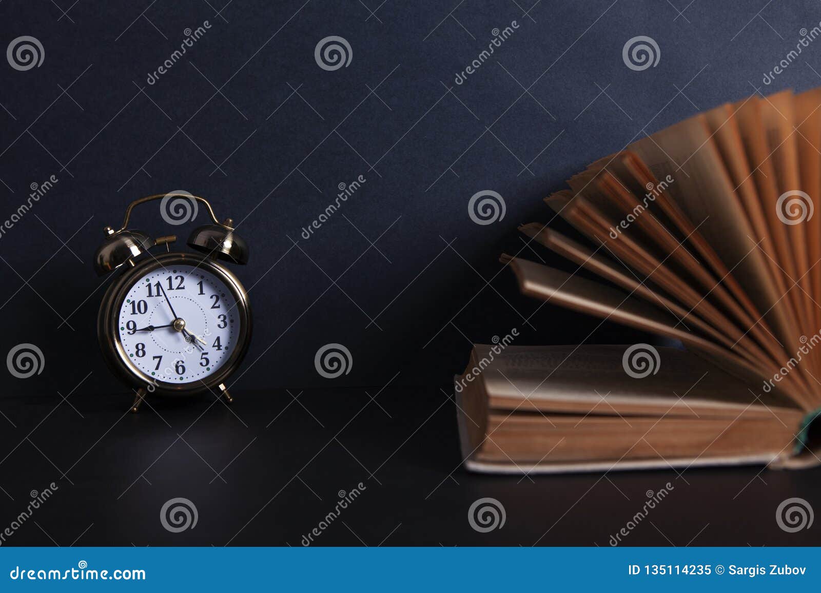 Book and Alarm Clock on the Desktop Stock Image - Image of timer, book ...