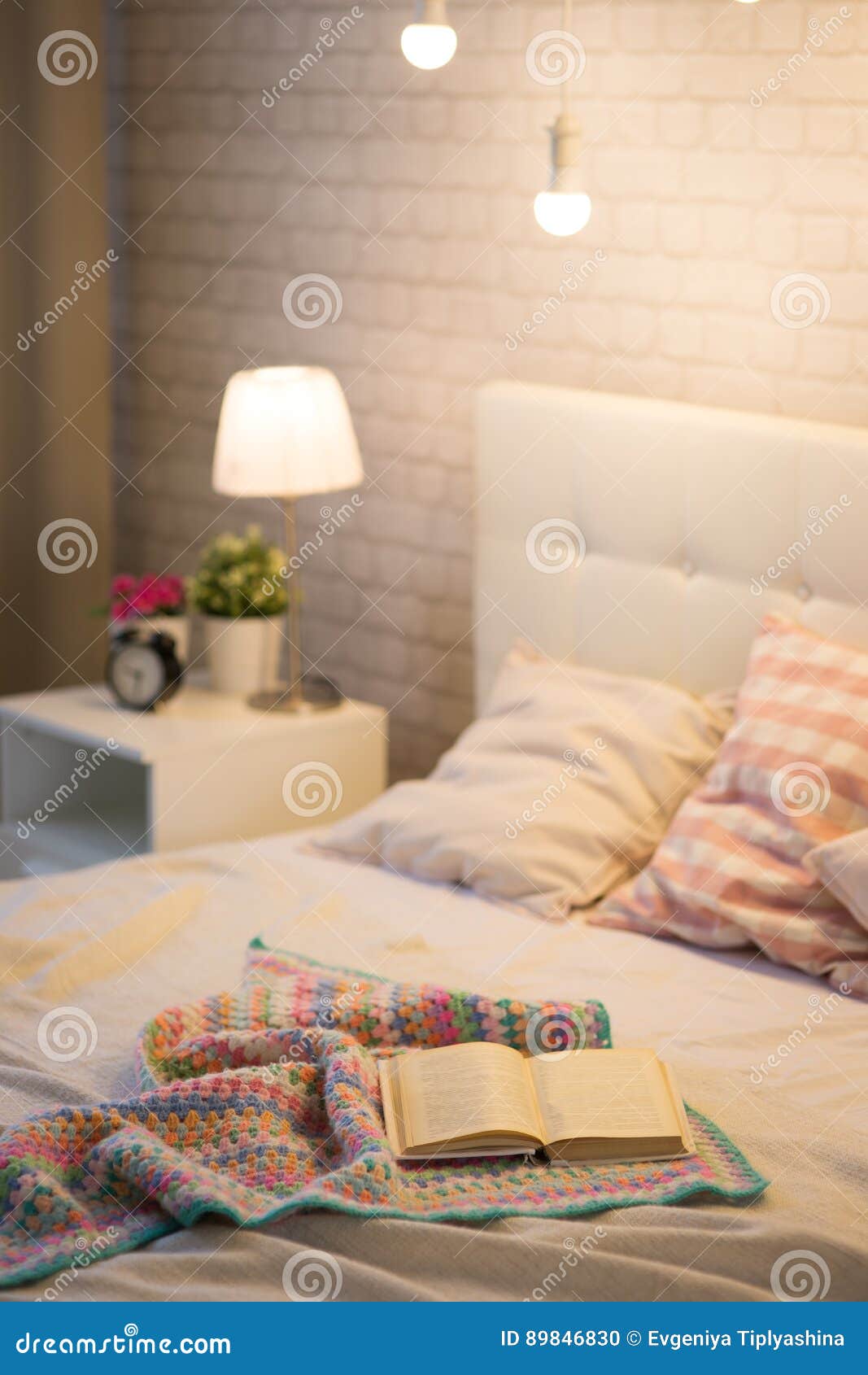 Book on the bed stock photo. Image of design, interior - 89846830