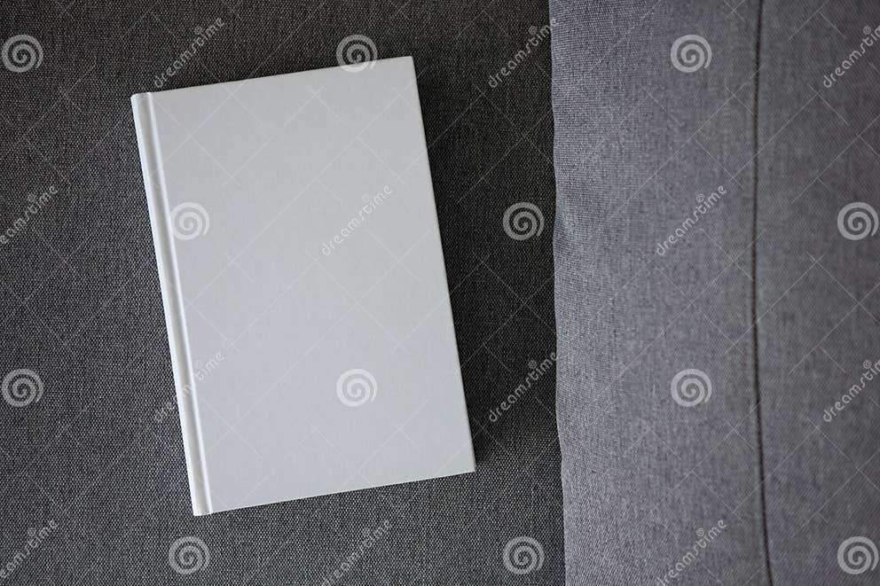 Book with Blank Cover and Empty Cover on a Sofa Stock Photo - Image of ...