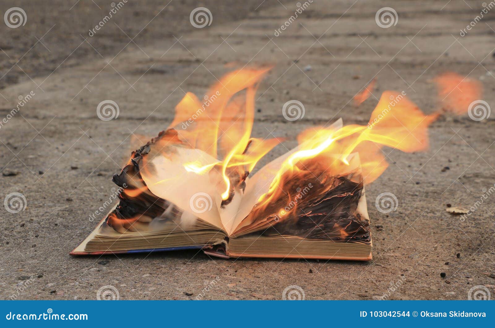 Book with Burning Pages on a Concrete Surface Stock Photo - Image of ...