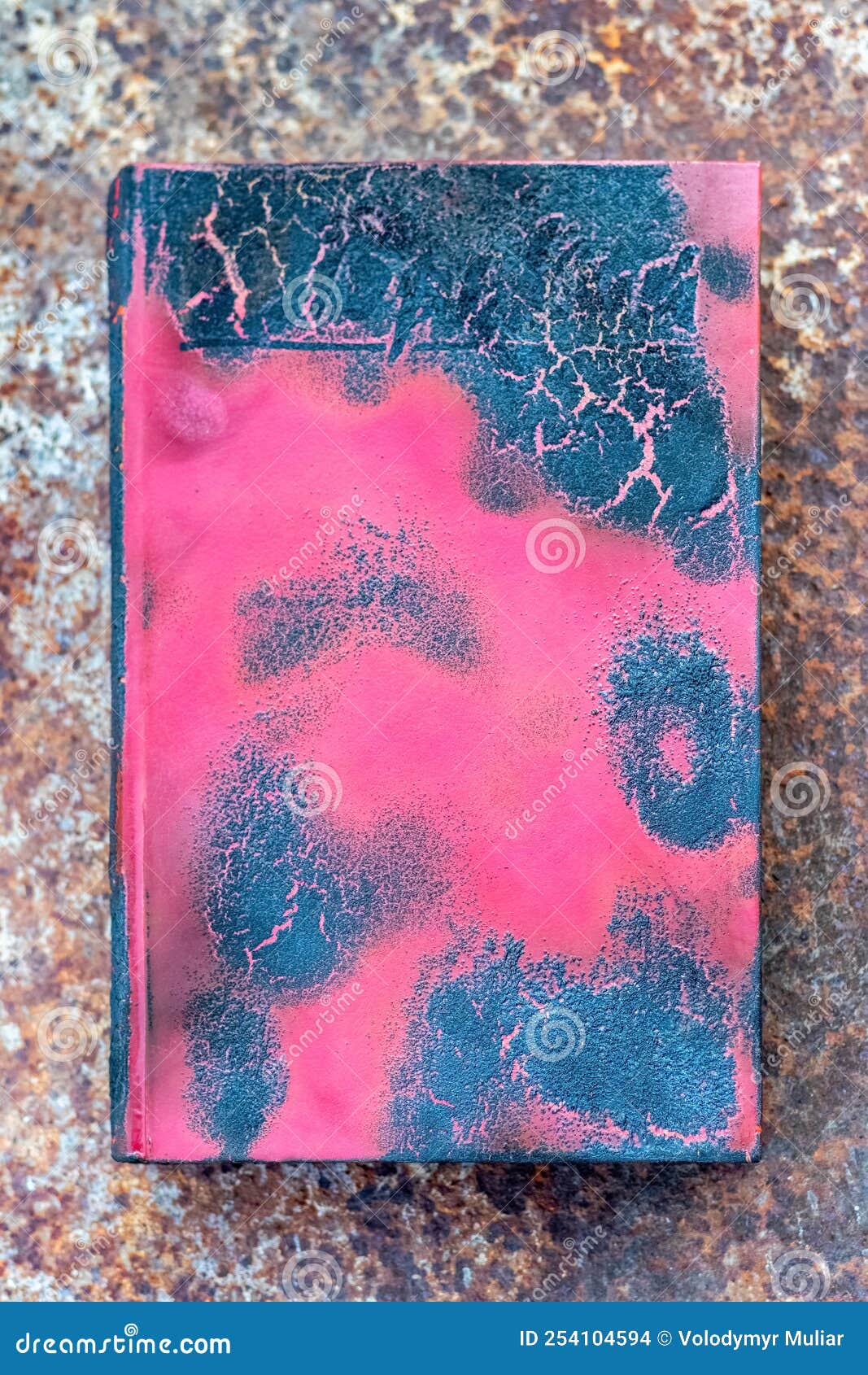 A Book with a Burnt Cover on a Metal Surface Stock Photo - Image of ...