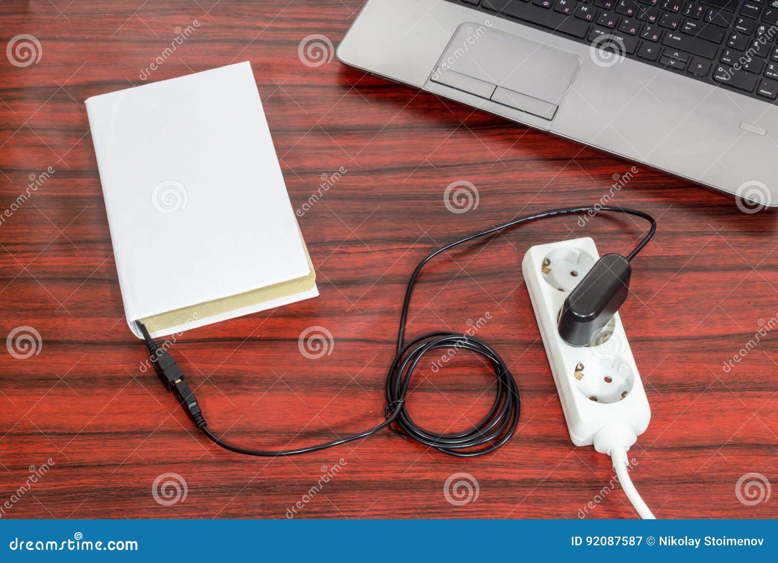 Book Connected To a Power Outlet. Stock Image - Image of office ...