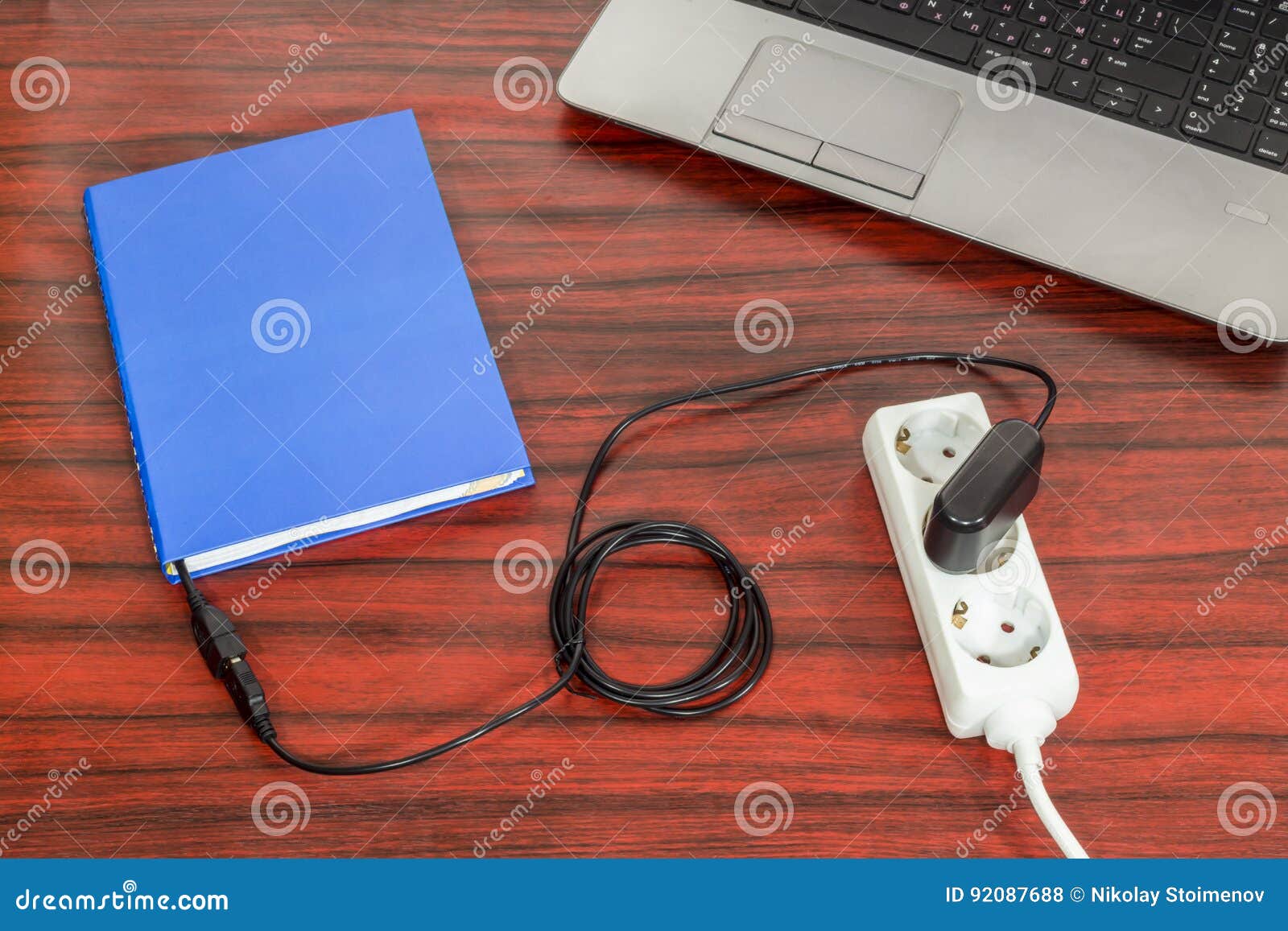 Book Connected To a Power Outlet. Stock Photo - Image of electronic ...