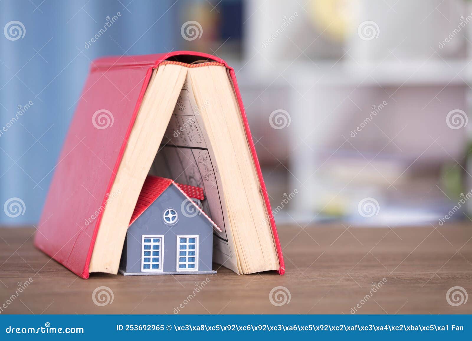 A Book Covers a Small House Model Stock Image - Image of books ...