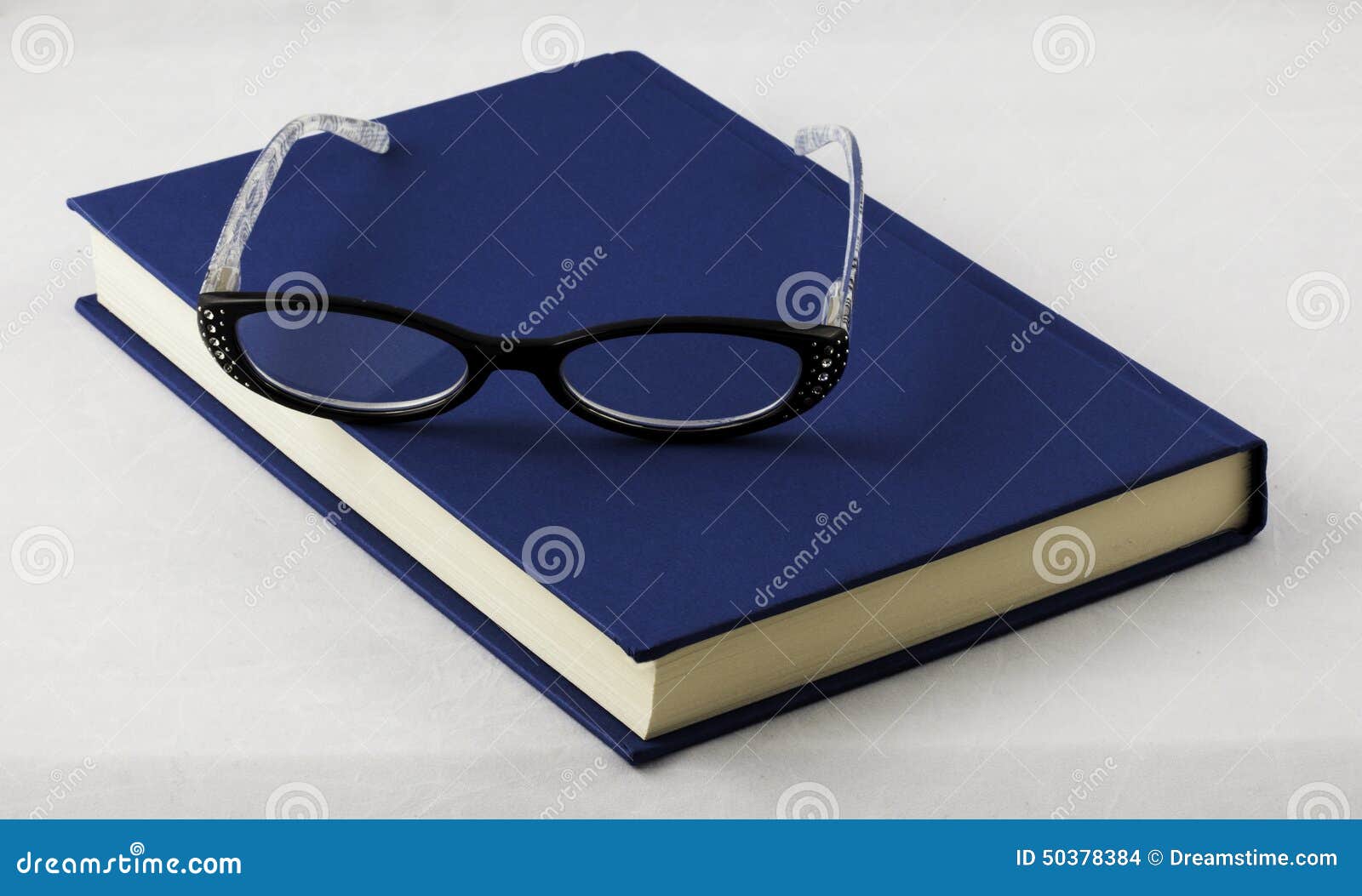 Book and eyeglasses stock photo. Image of eyeglasses - 50378384