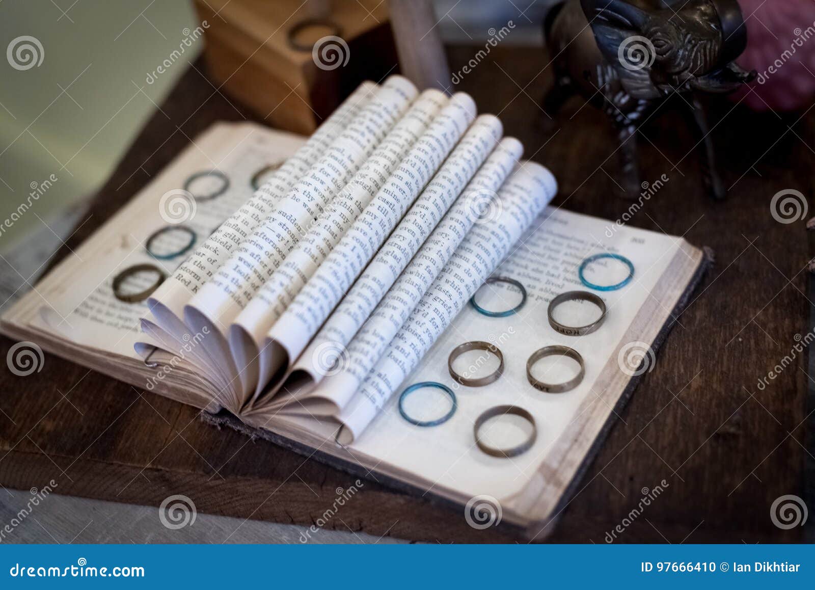 Book with a Folded Pages and Rings on it Stock Photo - Image of design ...