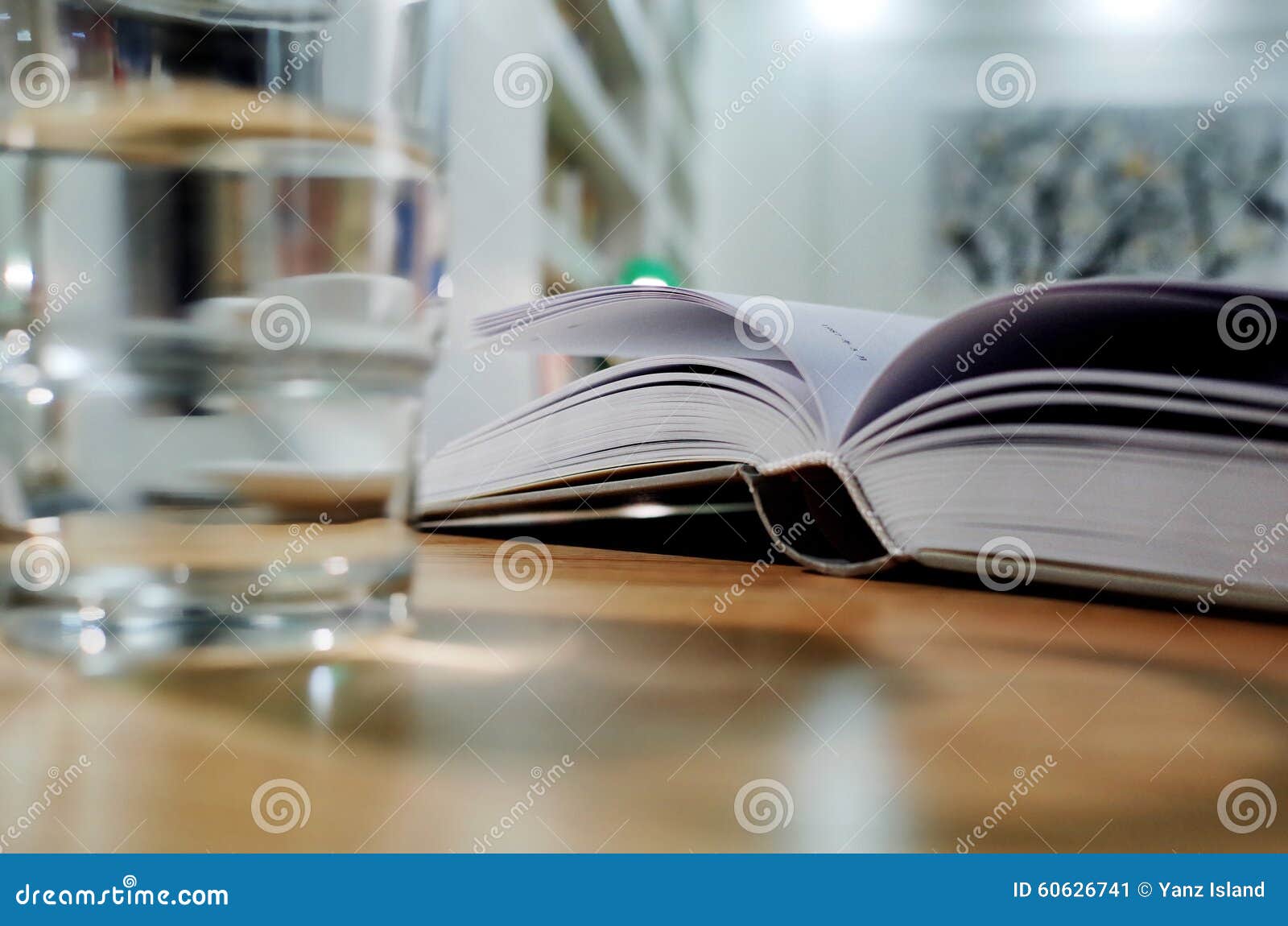 Book and glass cup stock image. Image of paper, glass - 60626741