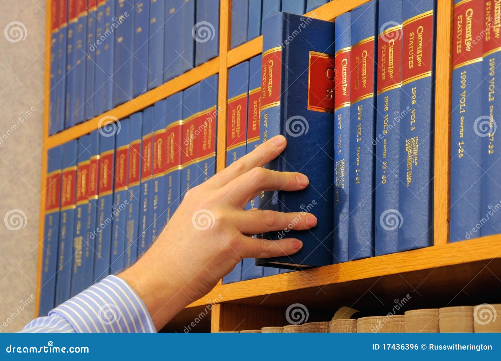 Book and hand stock photo. Image of wisdom, shelf, reading - 17436396