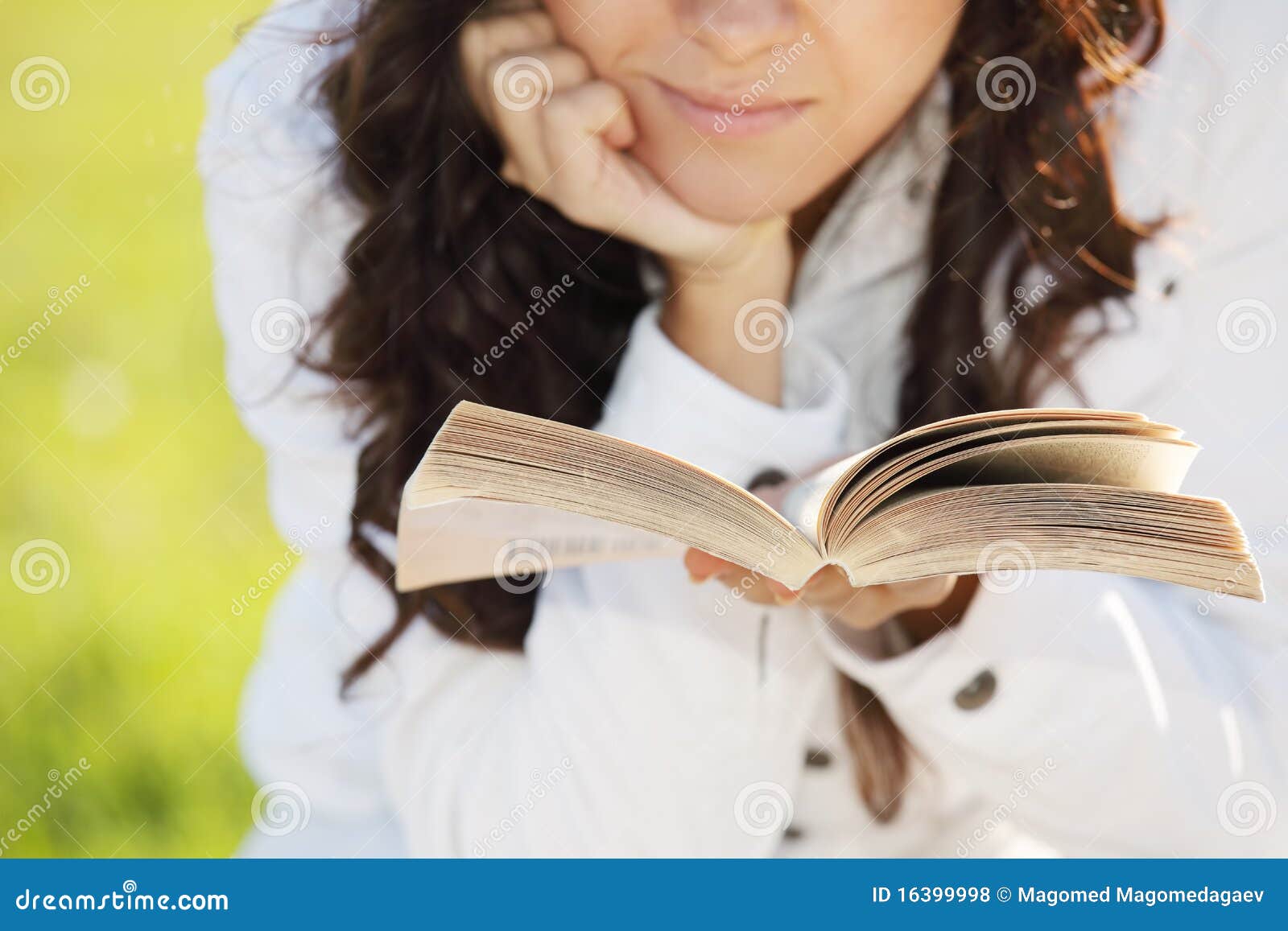 Book in hands of woman stock photo. Image of closeup - 16399998