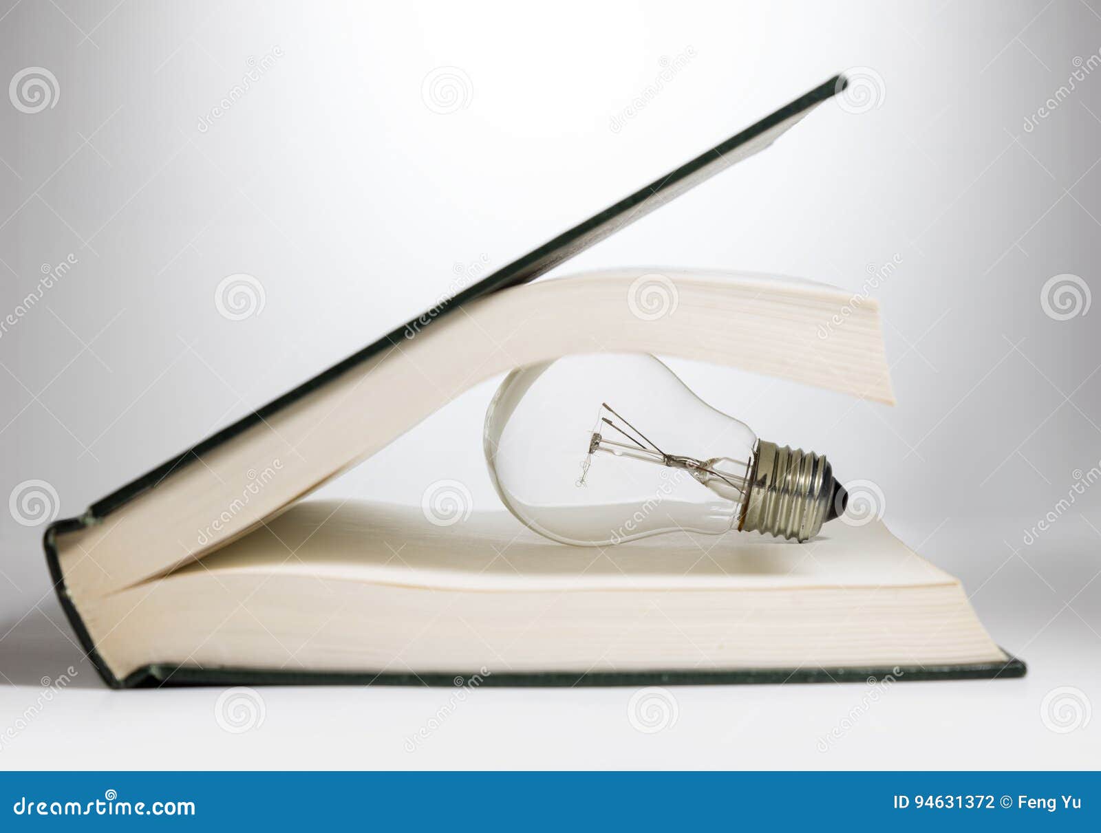 Book and light bulb stock photo. Image of knowledge, read - 94631372