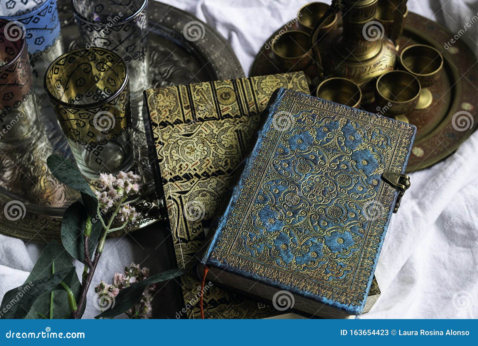 Book and Notebook with Arabic Style Decorations Surrounded by Tea Cups ...