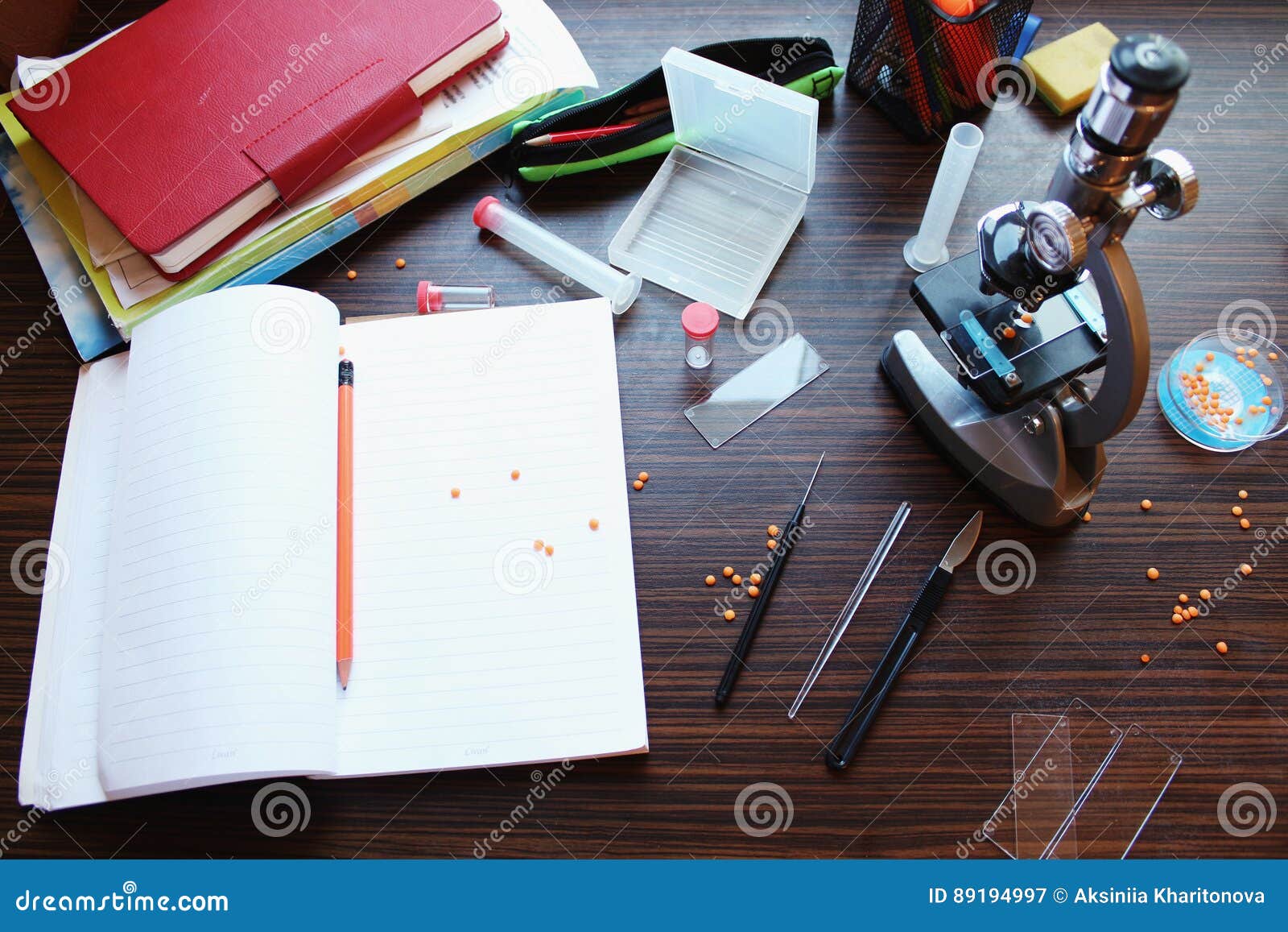 Book, Notebooks , Pen , Pencil and Microscope on the Table Stock Image ...