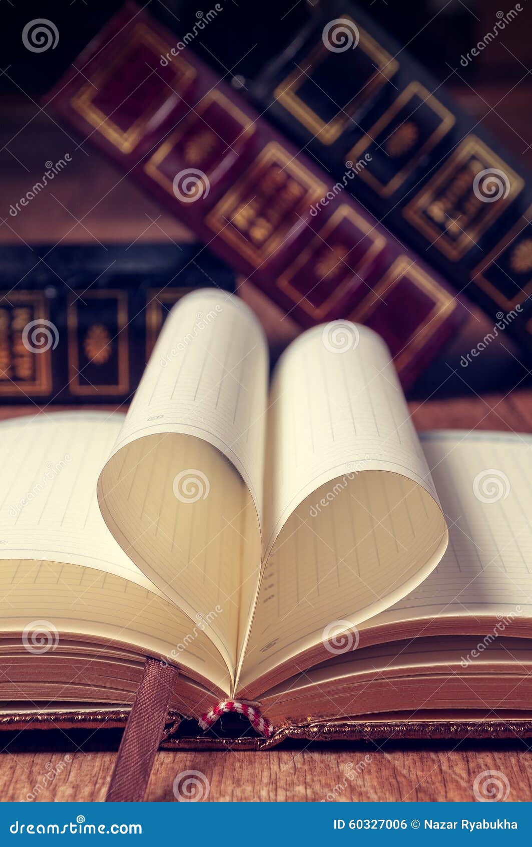Book Page in Heart Shape with Library Background Stock Photo - Image of ...