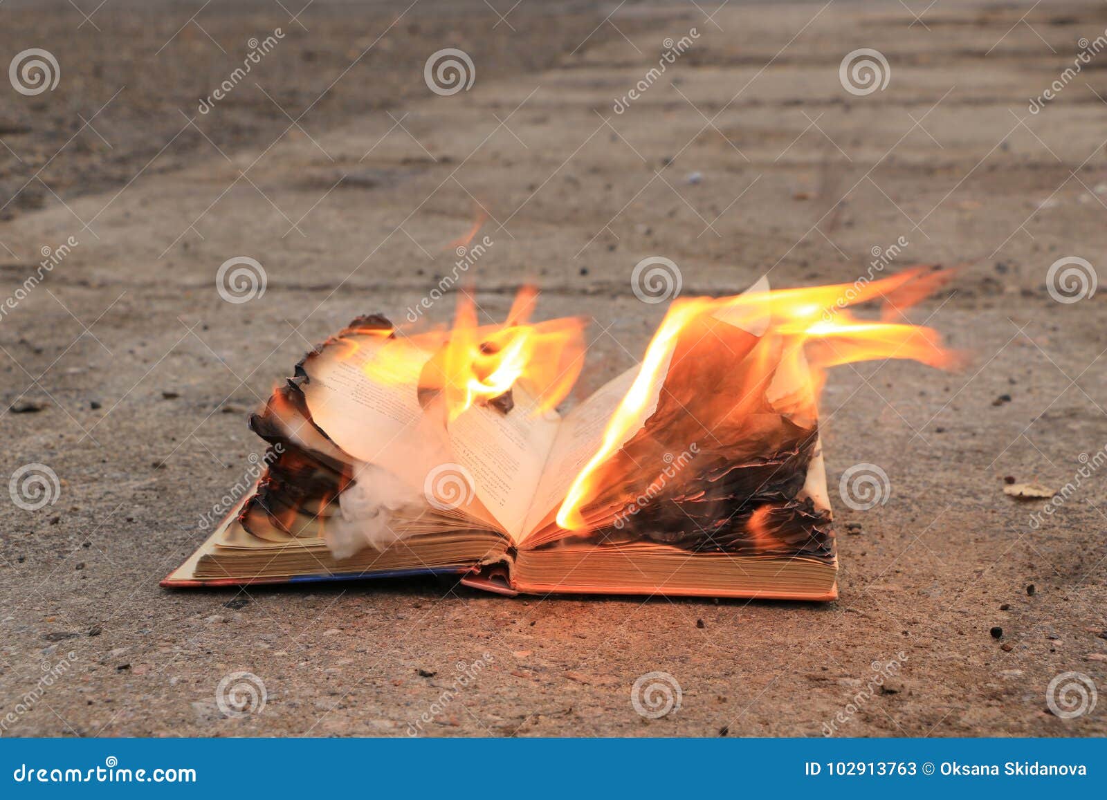 Book with Burning Pages on a Concrete Surface Stock Image - Image of ...