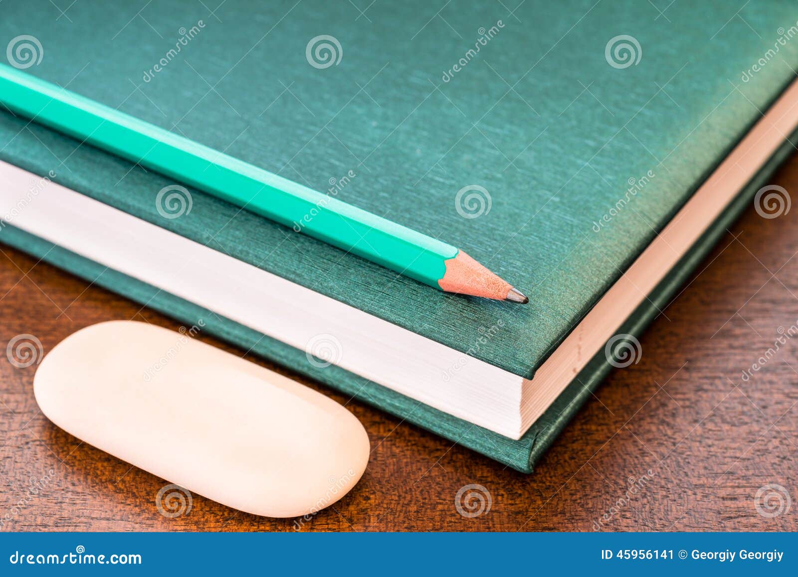 Book with a Pencil and Eraser on the Table Stock Image - Image of ...