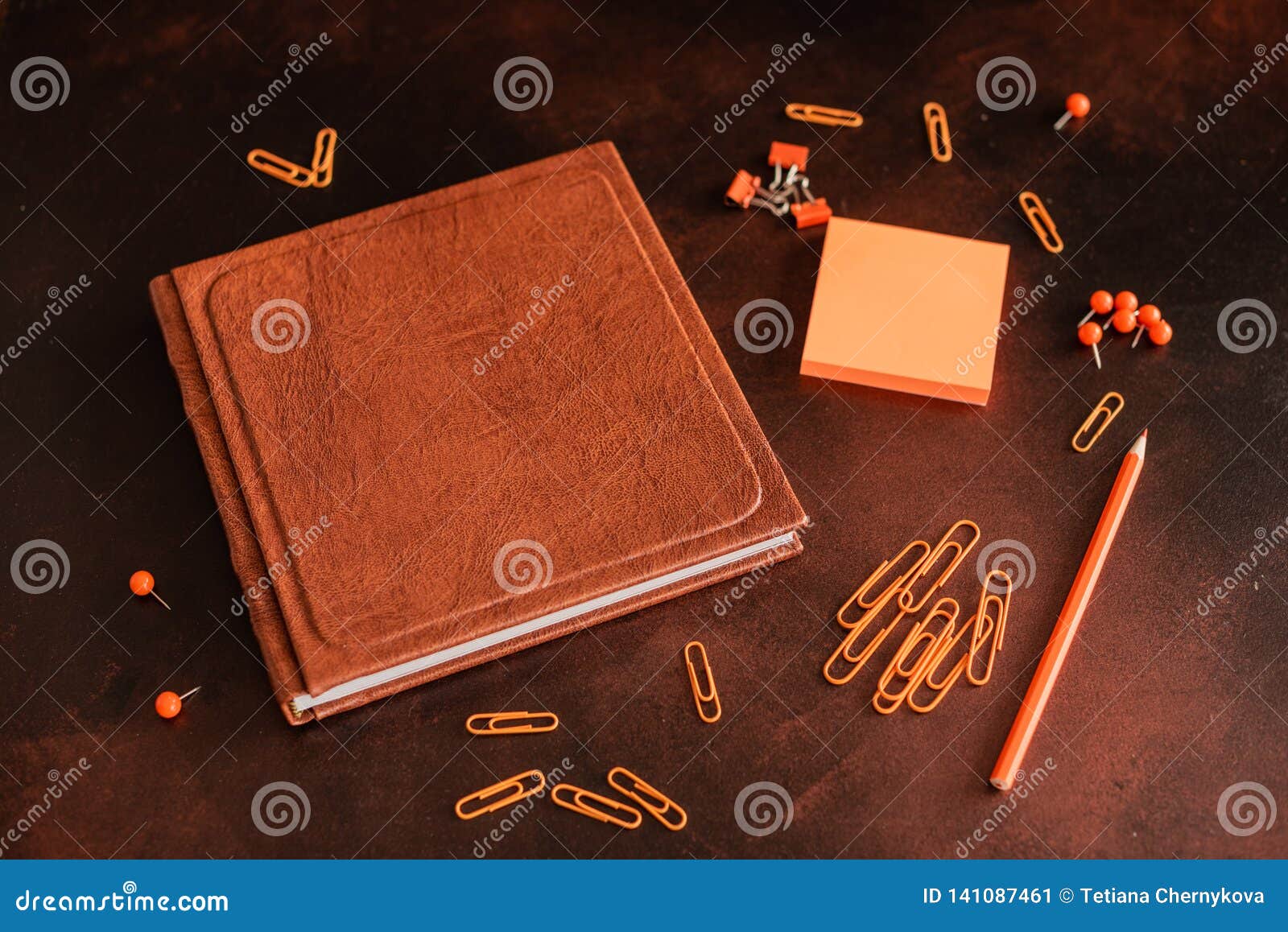 The Book, Pencil, Paper Clips and Sheets for Marks Lie on a Desktop ...
