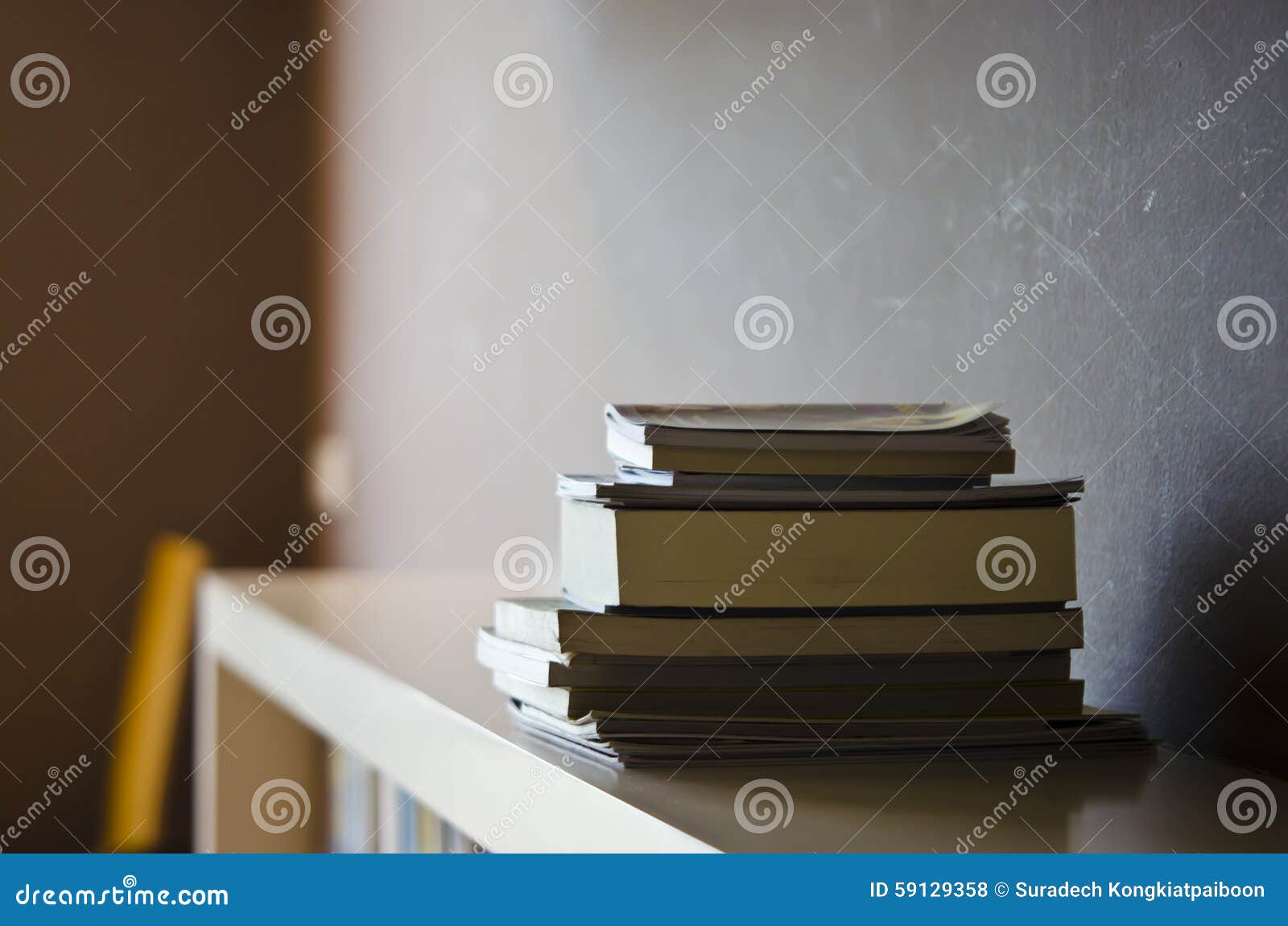Book Stack on a Shelf with Shade Lighting Stock Photo - Image of ...