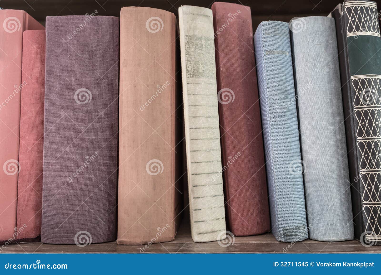 Book stack on wood shelf stock image. Image of novel - 32711545