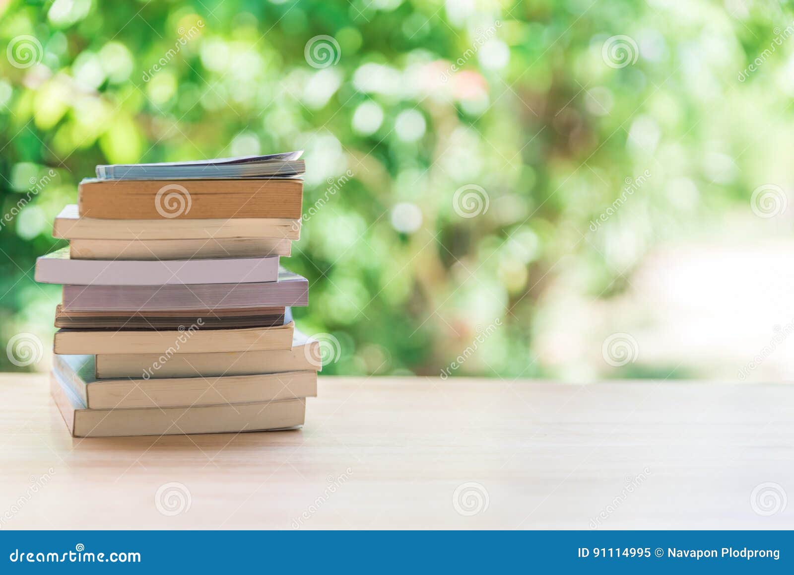 Book Stack on Wooden Table with Blur Background Stock Image - Image of ...