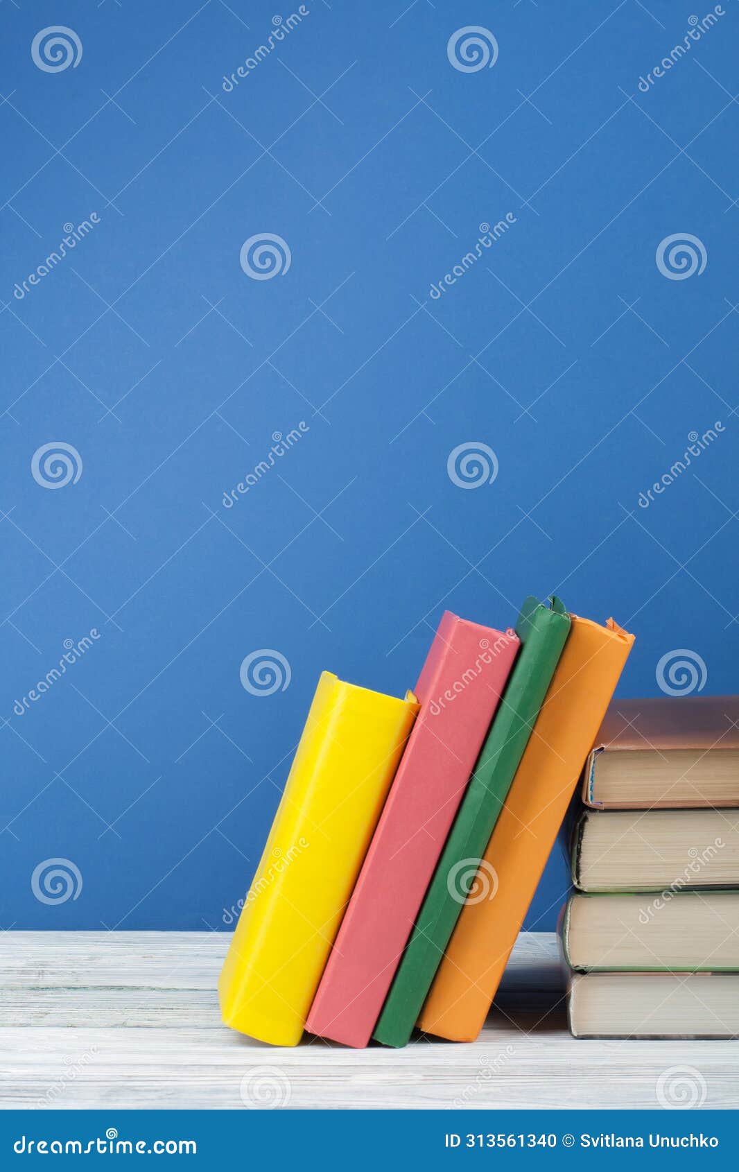 Book Stacking. Open Book, Hardback Books on Wooden Table and Blue ...