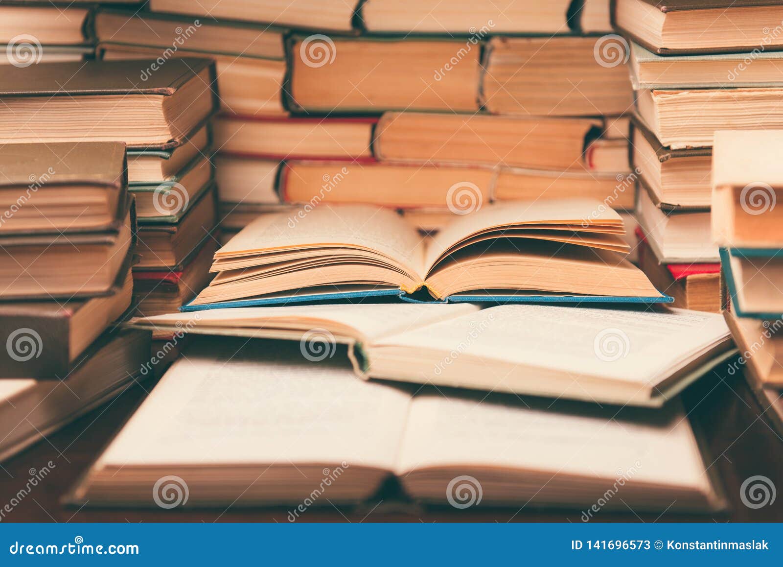 Book on the Table Against the Background of Books Stock Image - Image ...