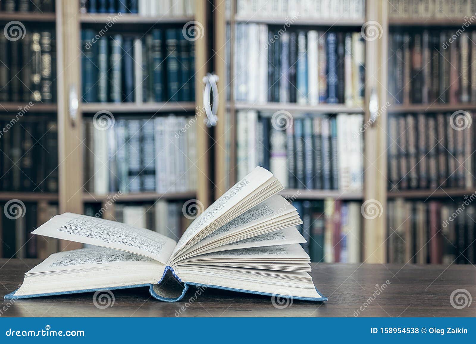 Book on the Table in the Background of the Library Stock Photo - Image ...