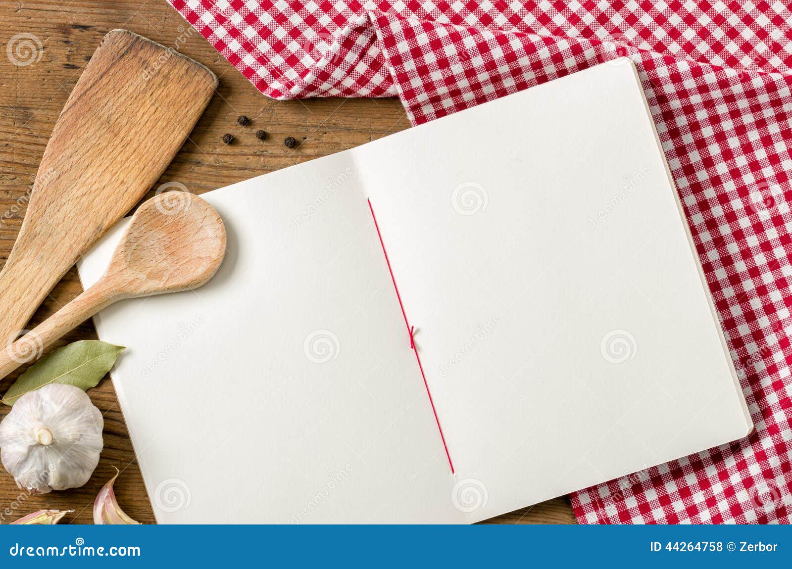 Book with Wooden Spoons on a Red Checkered Tablecloth Stock Photo ...