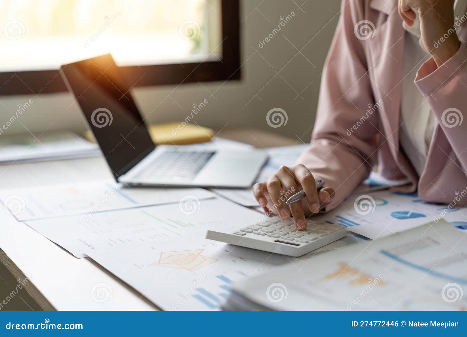 Bookkeeper Using a Calculator To Calculate Numbers on a Company S ...