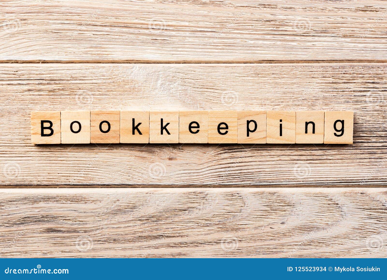 Bookkeeping Word Written on Wood Block. Bookkeeping Text on Table ...