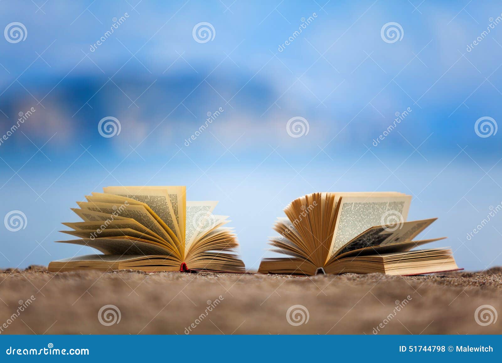 Books on a beach stock photo. Image of blue, bokeh, blur - 51744798