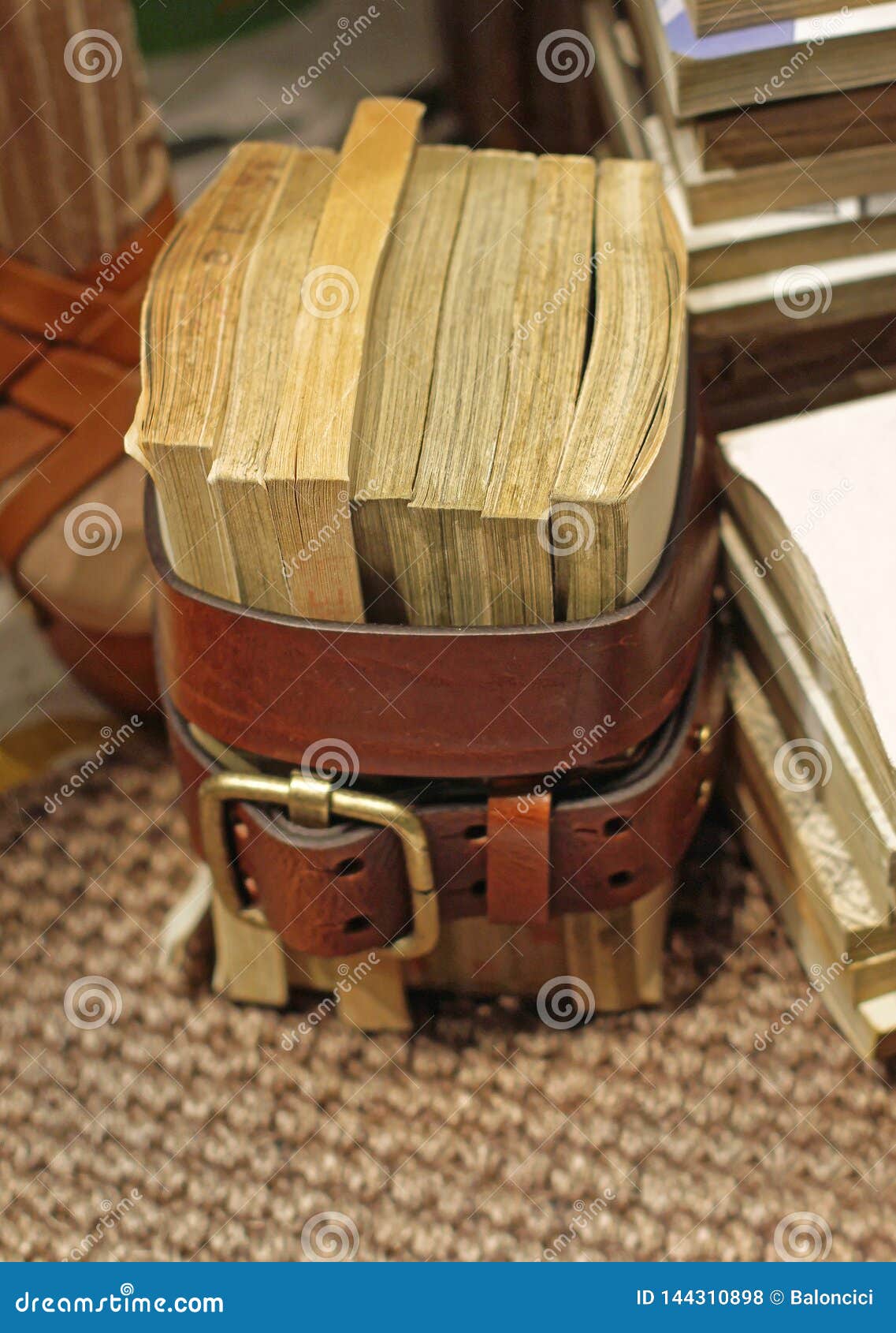 Books in Belt stock photo. Image of holding, vintage - 144310898