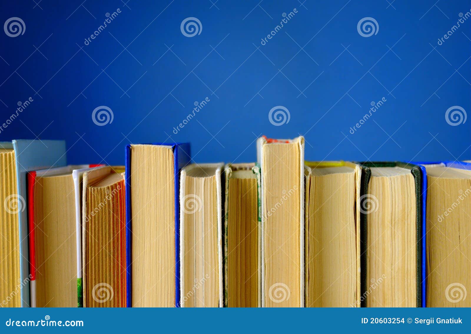 Books on a blue background stock photo. Image of locked - 20603254