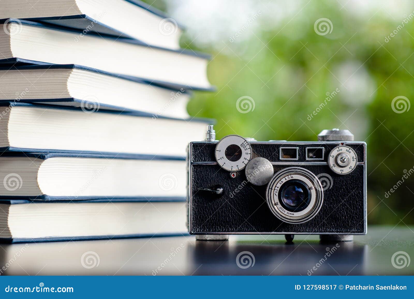 Books and Cameras Put on the Floor. White Leather Book and Study Stock ...