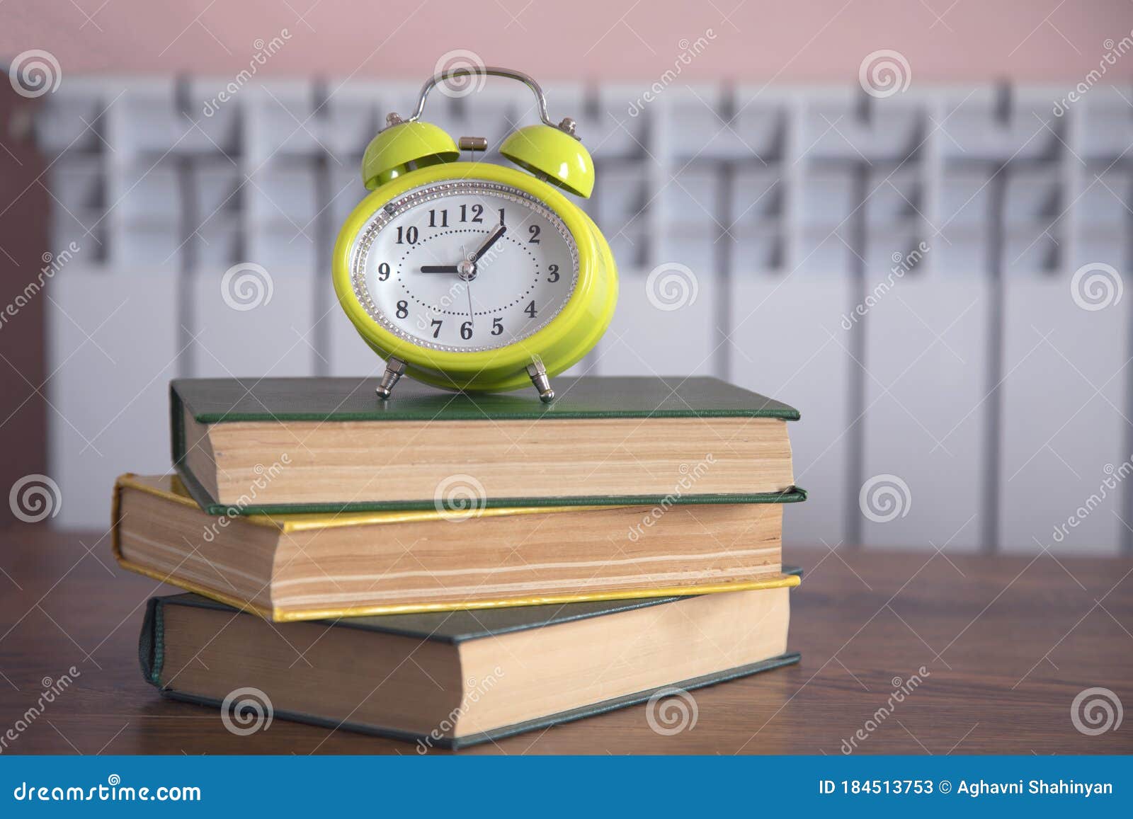 Books and clock on table stock image. Image of watch - 184513753