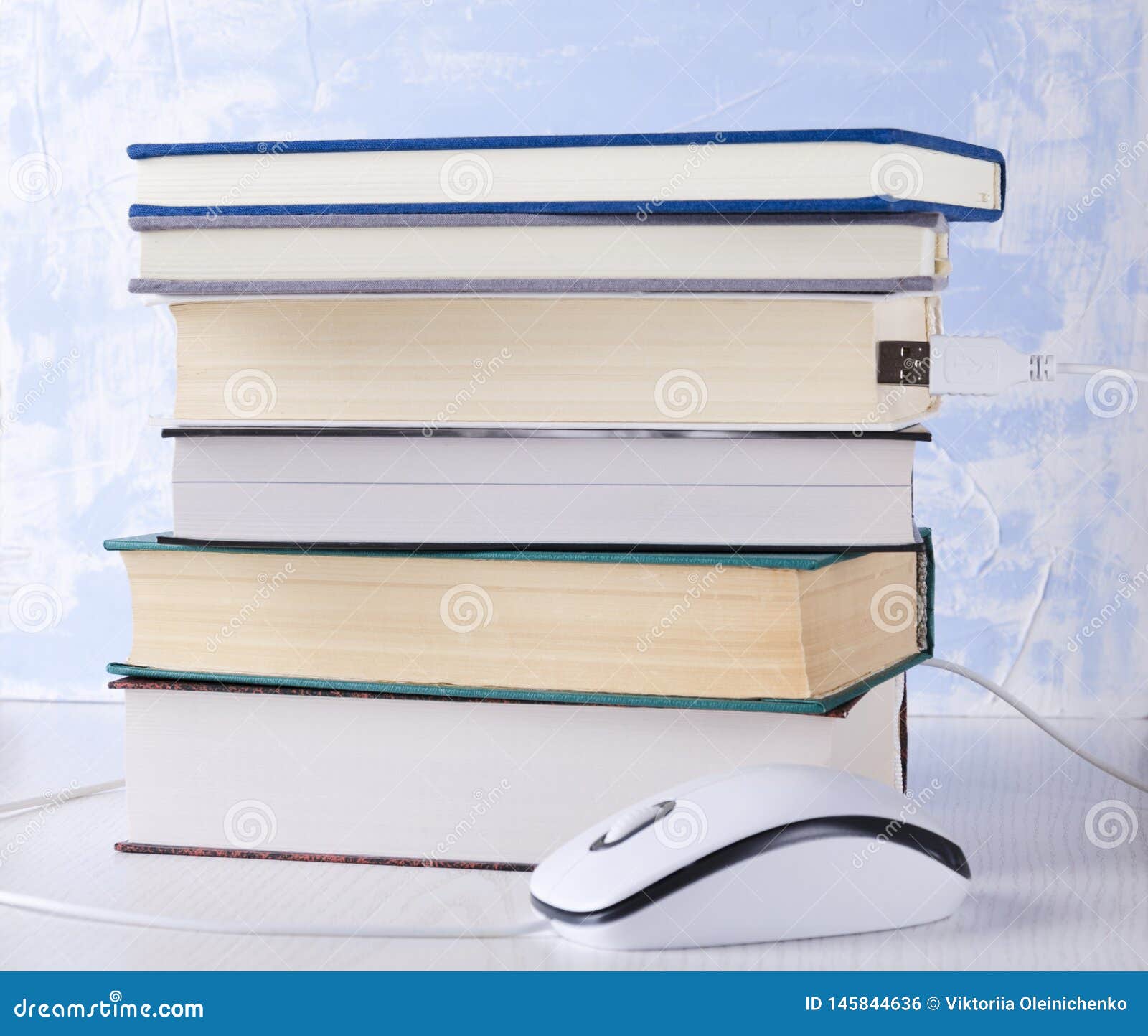 Closeup of Stack of Books and Computer Mouse.Concept of E-learning and ...