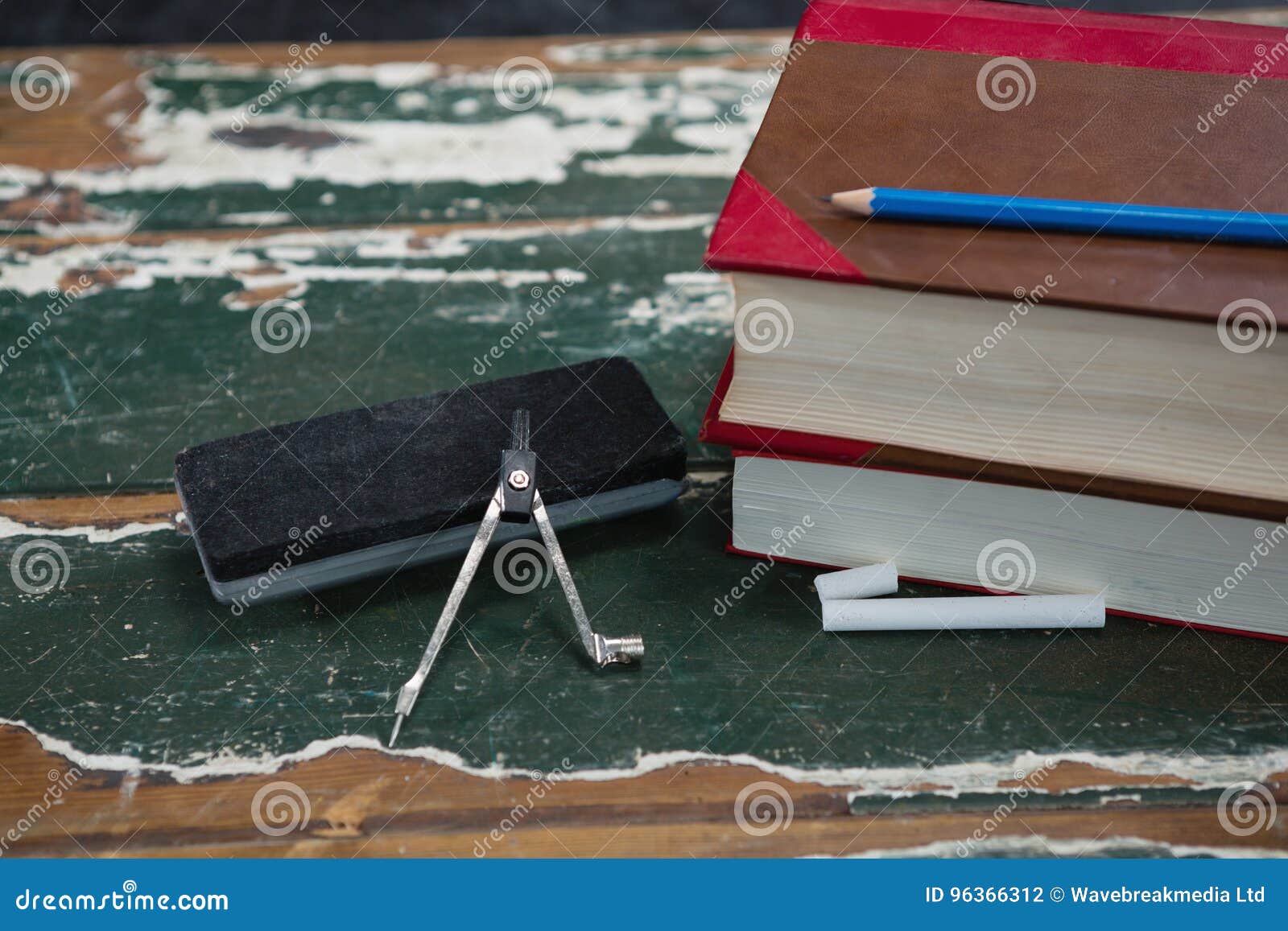 Books, Duster and Compass on Wooden Table Stock Photo - Image of ...