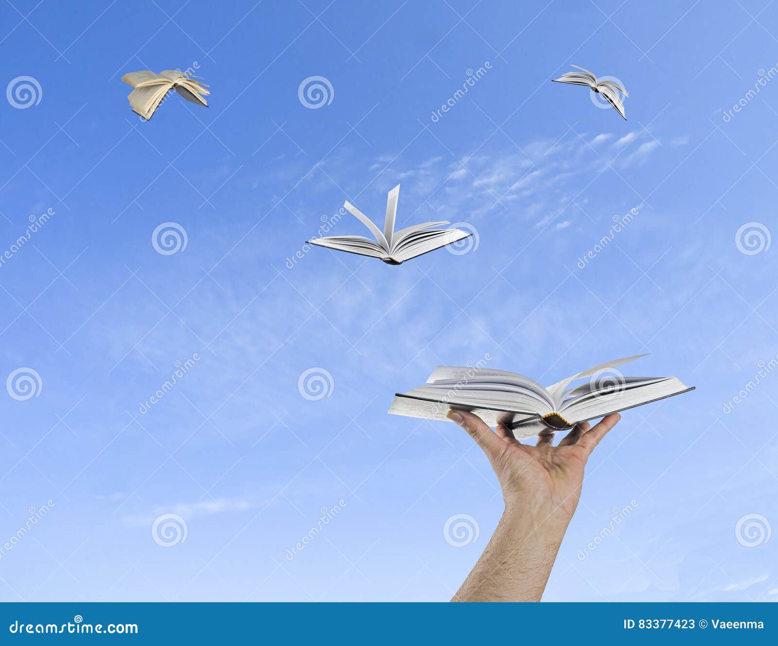 Books flying from hands stock image. Image of education - 83377423