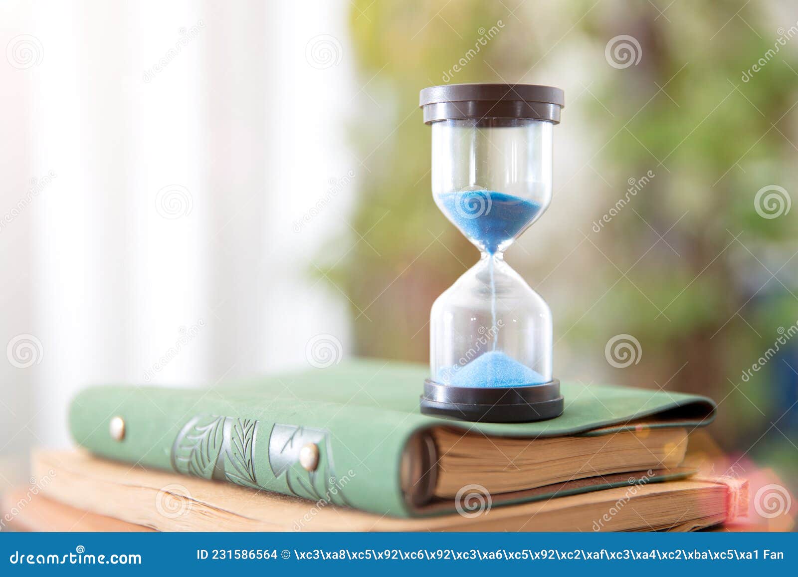 Books and Hour Glass on the Table Stock Photo - Image of concept ...